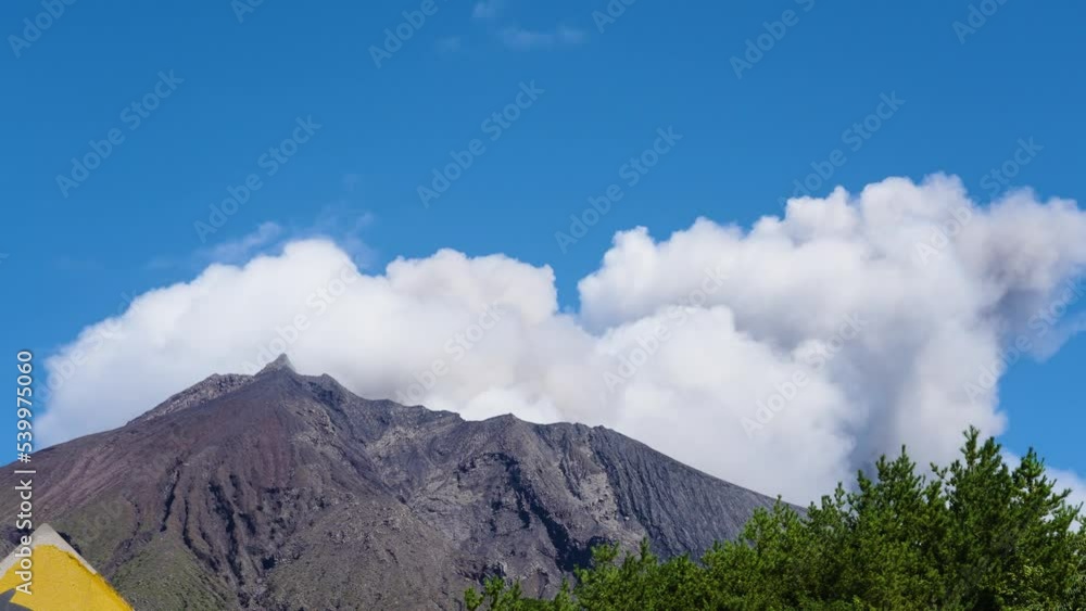 Sakurajima volcano in Kyushu Japan erupting, white smoke escapes ...