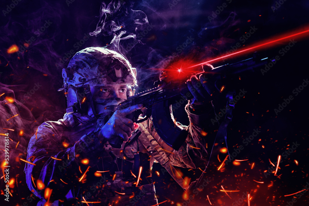 Army soldier in Combat Uniforms with an assault rifle and combat helmet ...