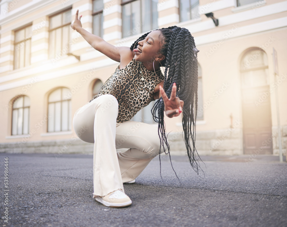 Black woman, street fashion and peace hand sign in city, squat and ...