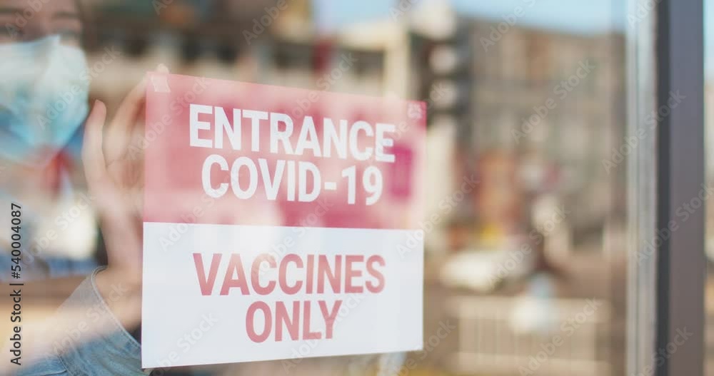 Entrance Covid-19 vaccines only. Plate with the inscription Entrance ...