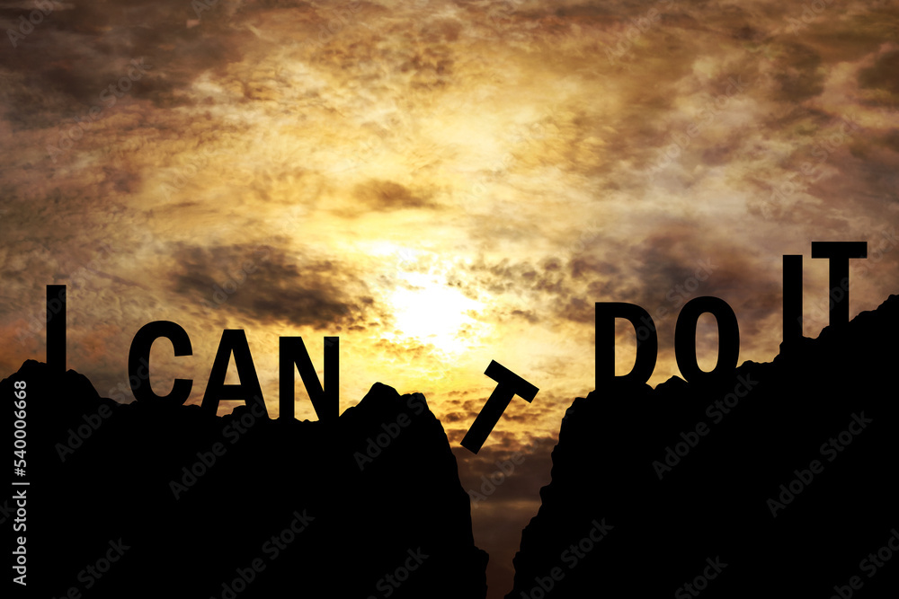 I can't do it, I can do it text on mountain top and letter T falling ...