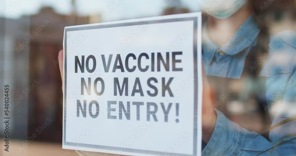 Plate with the inscription Entrance Covid-19 vaccines only on the ...