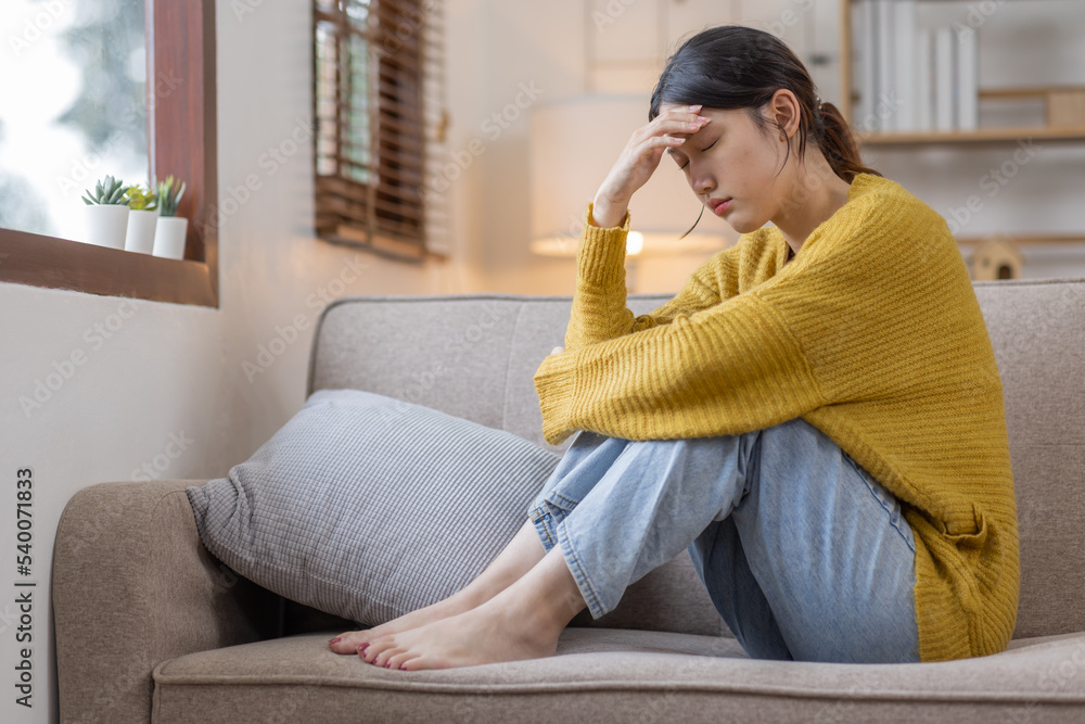 Depressed young Asian woman sitting on floor at home, Frustrated ...