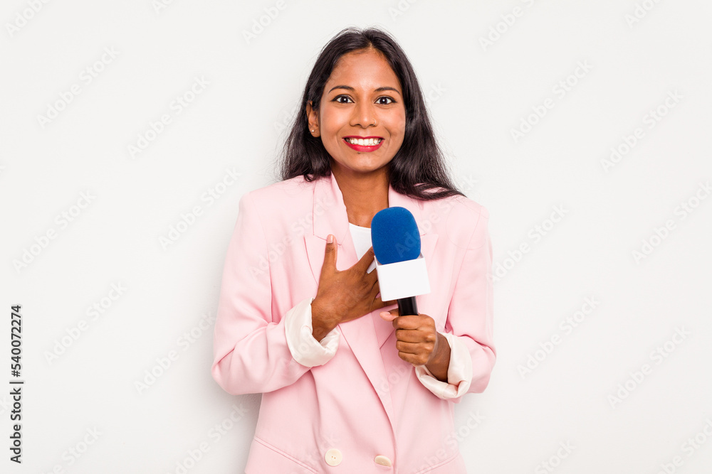 Young TV presenter indian woman isolated on white background laughs out ...