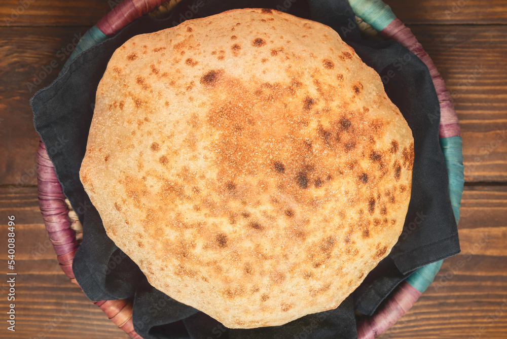 Egyptian traditional bread "Aish Baladi". This vegan bread is a mixture ...