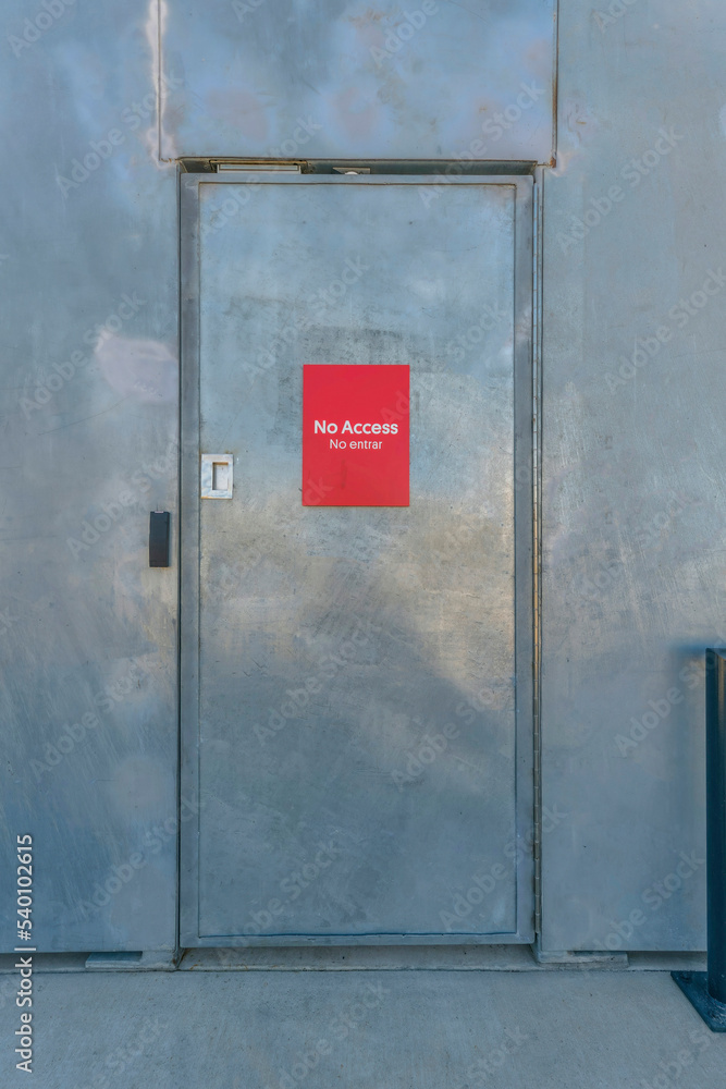 Bright red No Access signage on a shiny door at Waterloo Park Austin ...