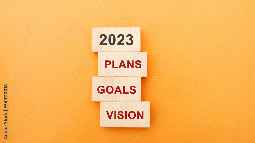 Wooden blocks with the word 2023, plans, goals, vision. Setting goal ...