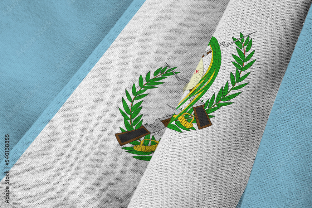 Guatemala flag with big folds waving close up under the studio light ...