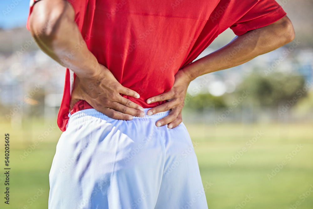 Field, soccer and man with back injury in game tournament with pain ...