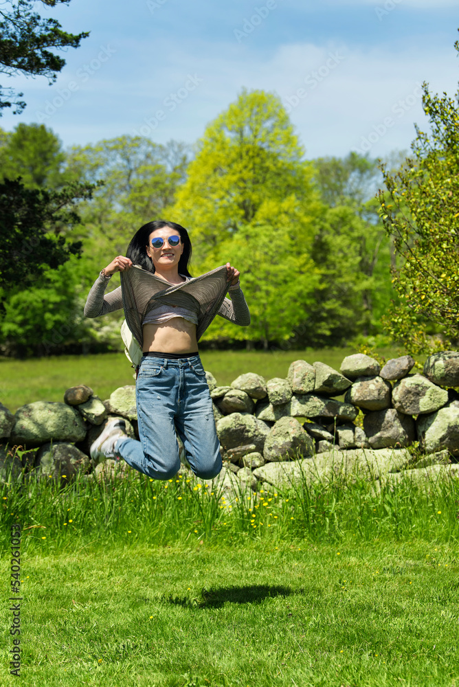 chinese woman juming and flashing her bra outside Stock Photo | Adobe Stock