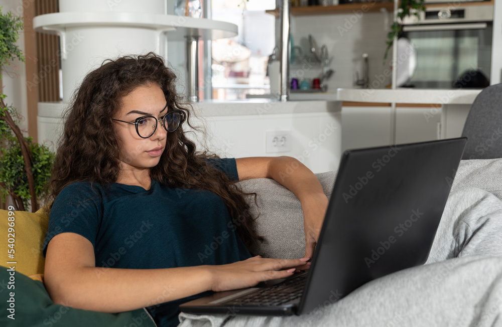 Young schoolgirl or college student teenage reading examination ...
