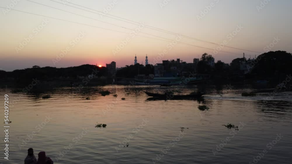 Rowing boats cross the Balu River as dusk falls in Bangladesh Stock ...