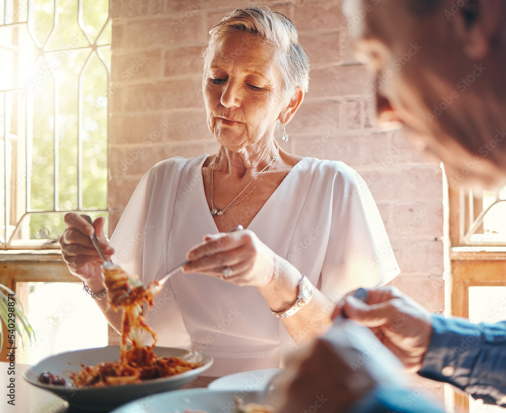 Old couple eating pasta at restaurant together on a date celebrating ...