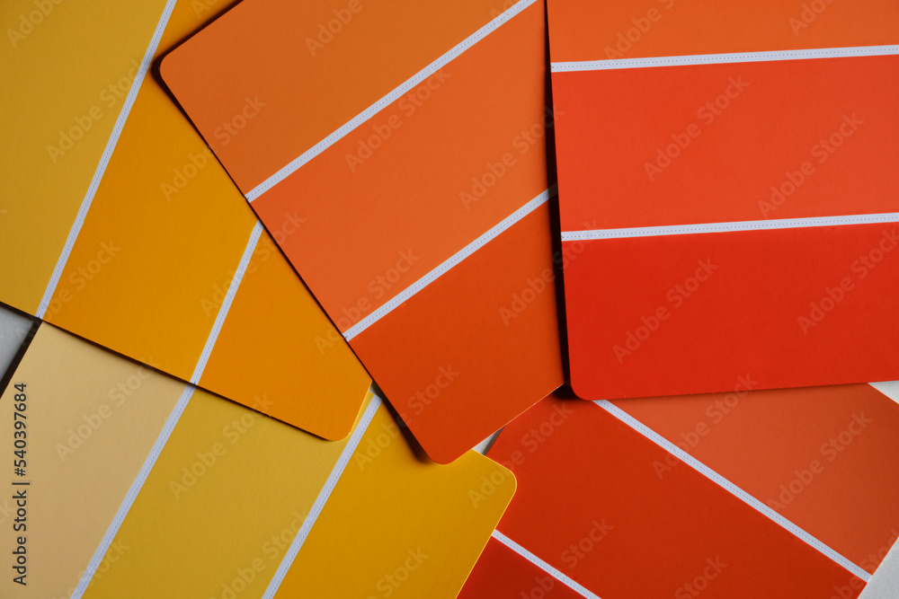 Generic color swatches scattered on a table. Swatches are in various ...