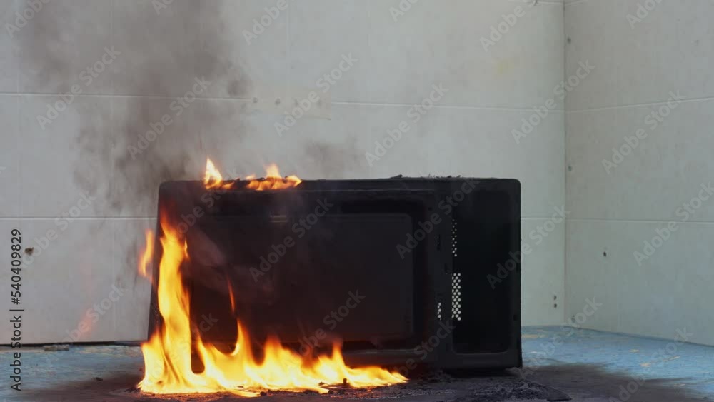 Video „microwave oven on fire. the concept of fire in the kitchen and ...