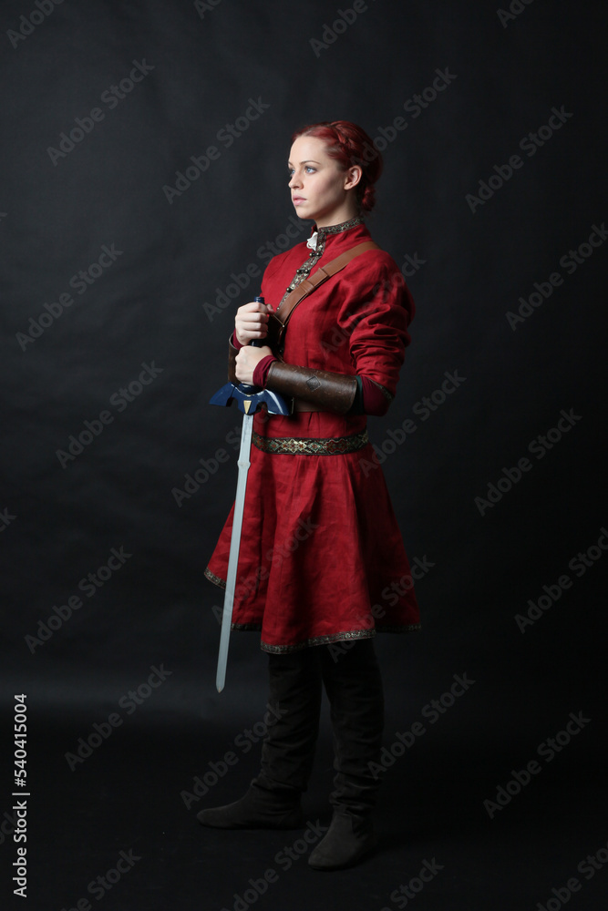 portrait of beautiful woman wearing a red medieval fantasy warrior ...