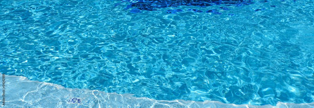 Swimming pool with blue water, ripples and highlights. Texture of water ...