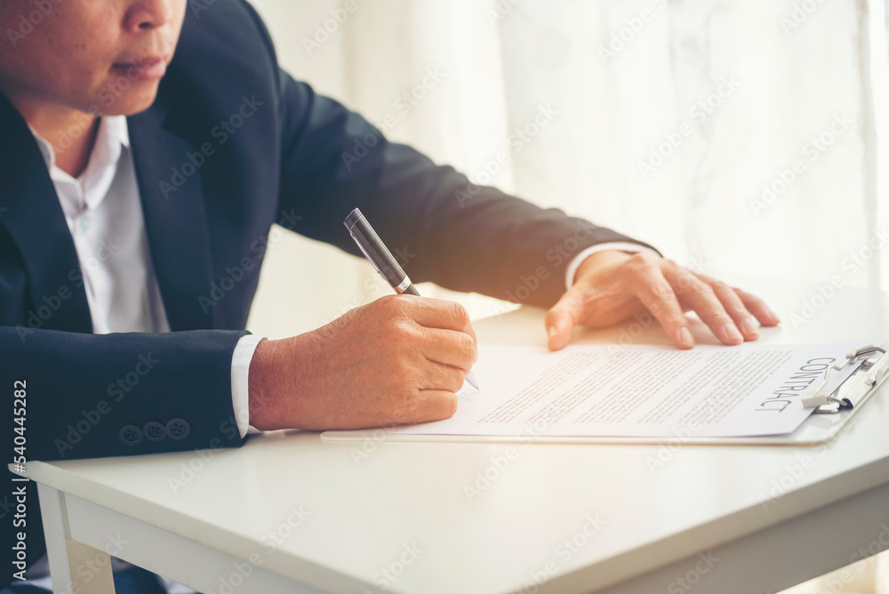 Asian business man using pen signing on new contract to starting ...