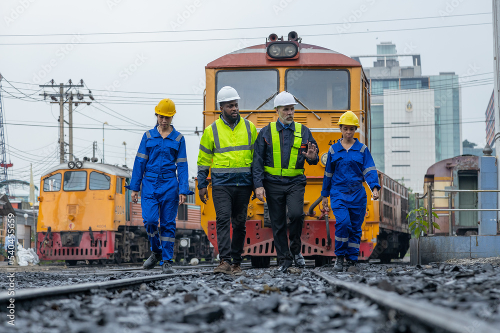 Railway engineer inspects diesel engine Report on the progress of ...