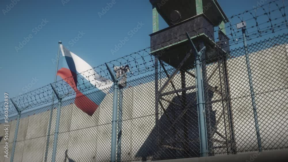 Vidéo Stock Russian flag above heavily guarded building, penitentiary ...