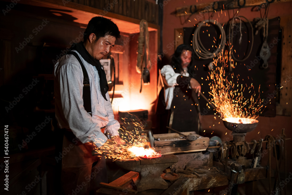 vintage style portraits Two cowboys fixing horseshoes in the smithy ...