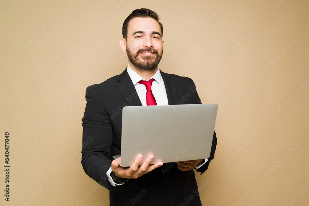 Attractive salesman typing on the laptop Stock Photo | Adobe Stock