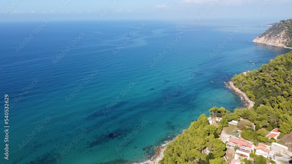 The beautiful turquoise blue color of the Ionian Sea that surrounds the ...