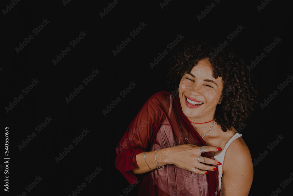 Smiling beautiful woman with red cloth wrapped around her body against ...