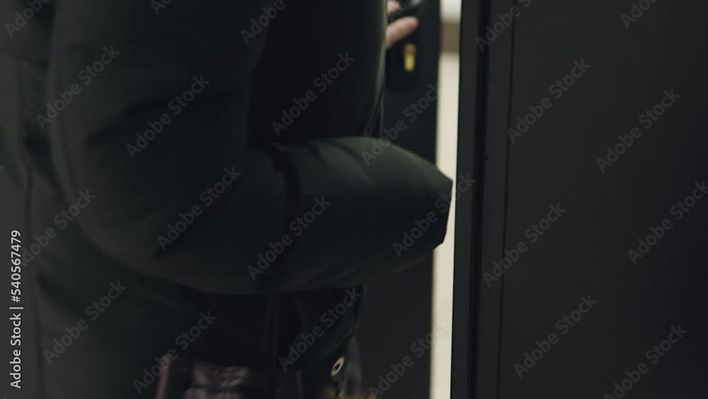 hand holding door handle opening entering entrance silhouette Caucasian ...