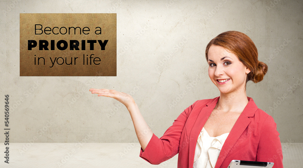 smiling businesswoman in front of a wall with the message BECOME A ...