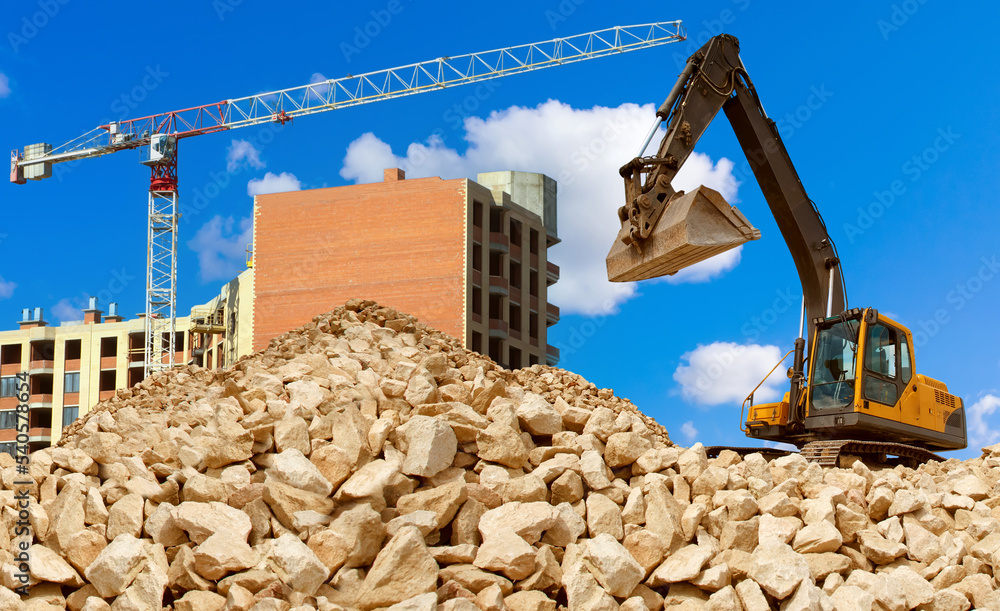 Foto de Demolition buildings. Construction machinery in front of ...