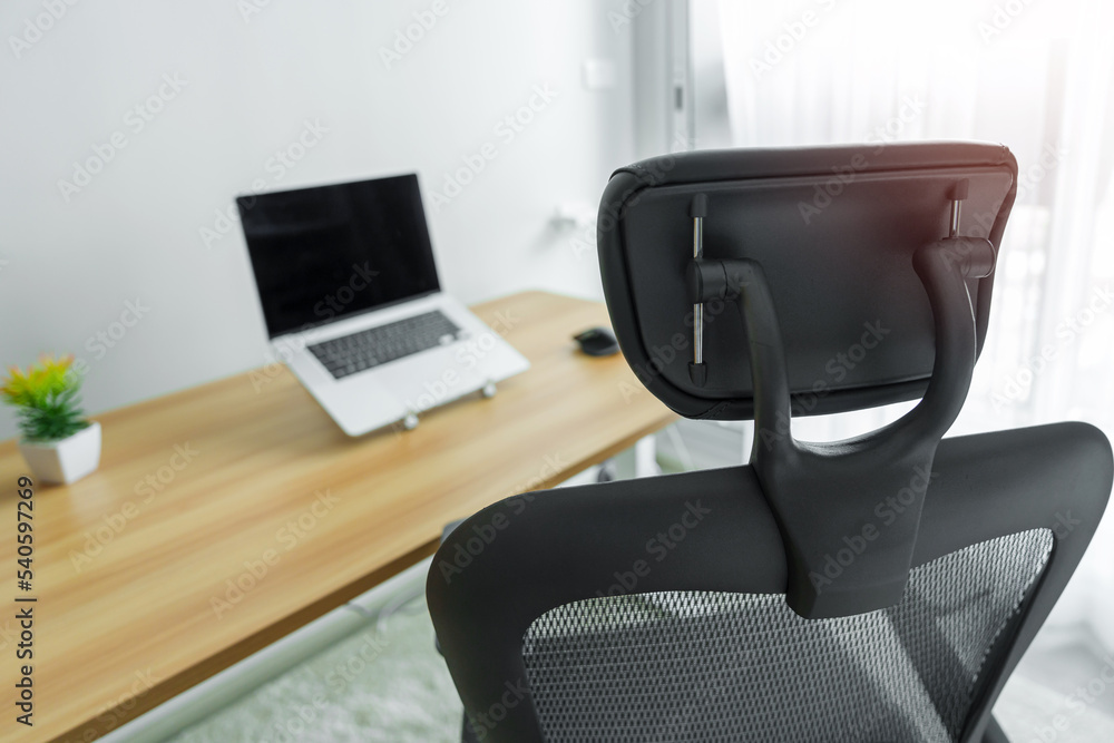 Ergonomic chair and Adjustable table with laptop computer in modern ...