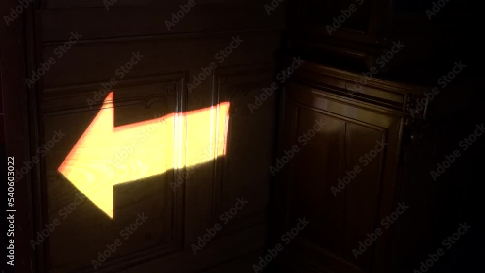 Copenhagen, Denmark Unidentified people walk by an illuminated arrow at ...