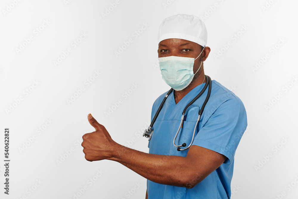 Black surgeon doctor man in blue coat white cap and surgeon mask with ...