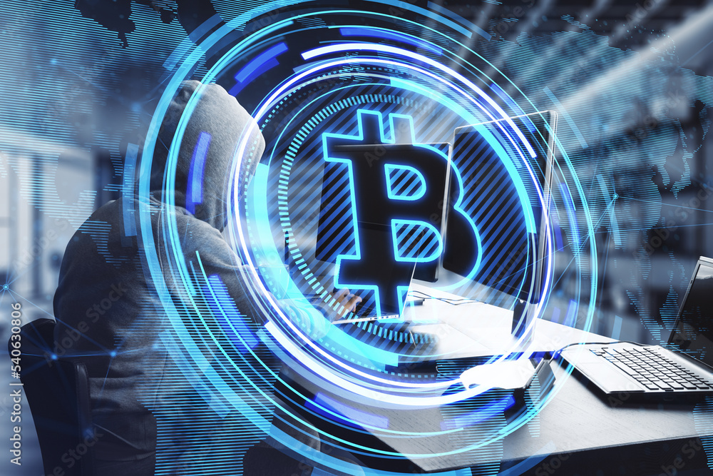 hacker hands using computers at desktop with creative glowing bitcoin ...