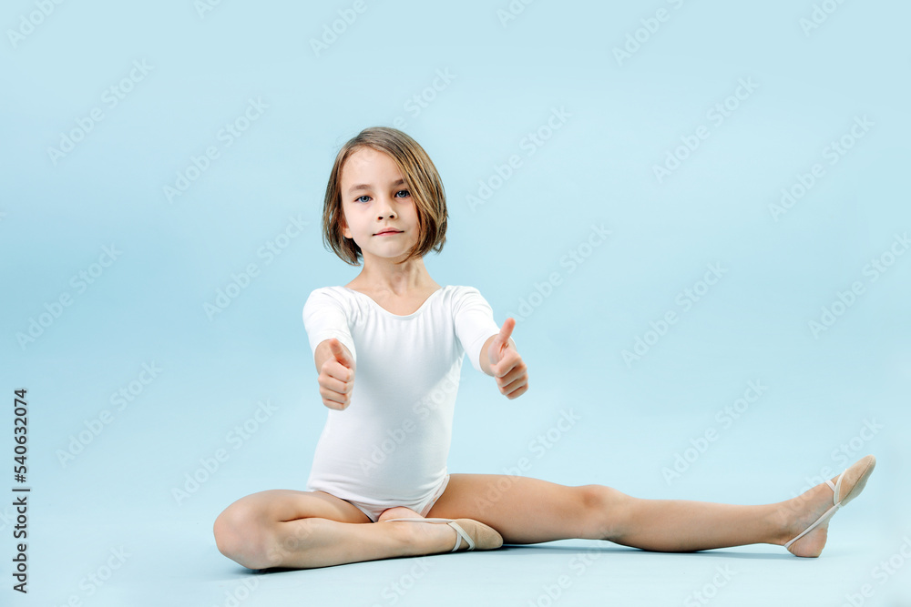 Tired Girl In A White Leotard Sitting In Half Splits Giving Thumbs Up