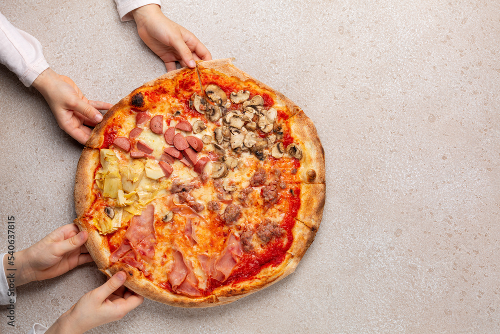Foto de Girl's hands with pizza Four seasons. Mozzarella cheese ...
