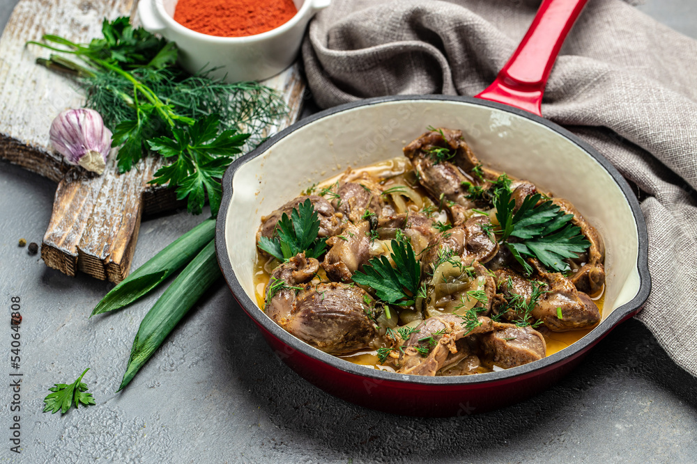 Stewed chicken stomach in pan. Traditional Korean spicy chicken meat on ...