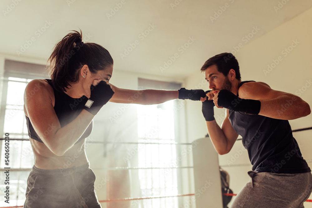 Young boxers fighting inside a boxing ring Stock Photo | Adobe Stock