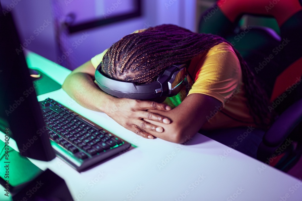 African american woman streamer stressed using computer at gaming room ...