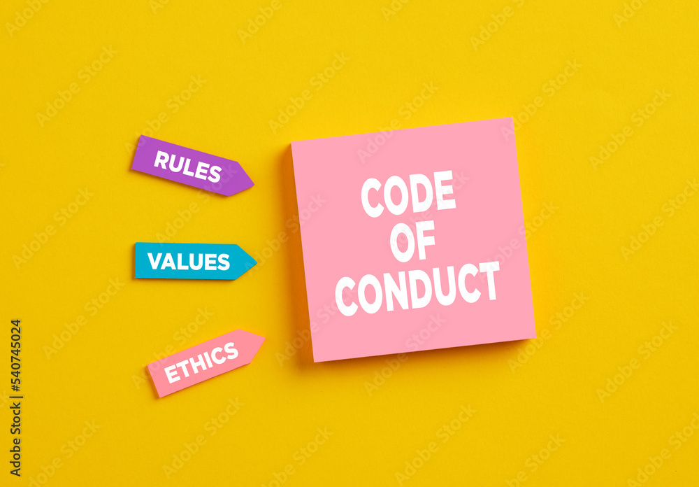 The word code of conduct on pink note paper. The components of code of ...