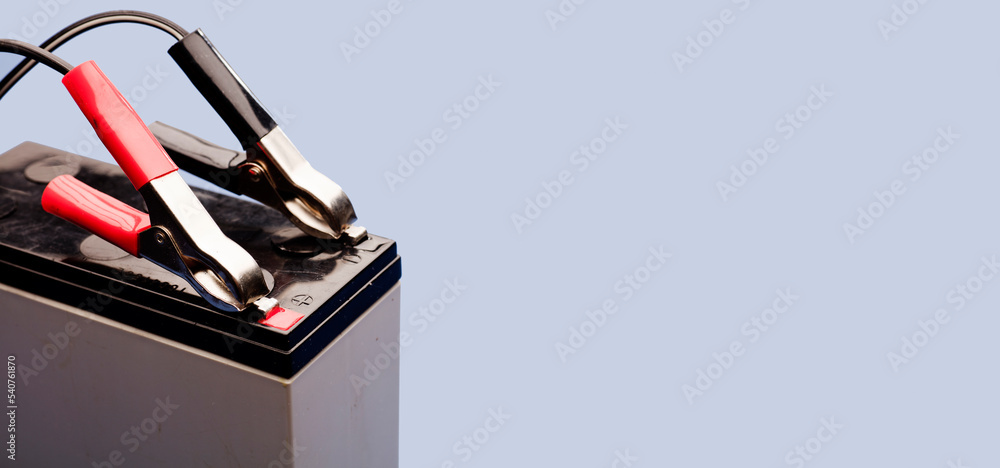 connected bolts charging battery positive pole and negative pole, blue ...