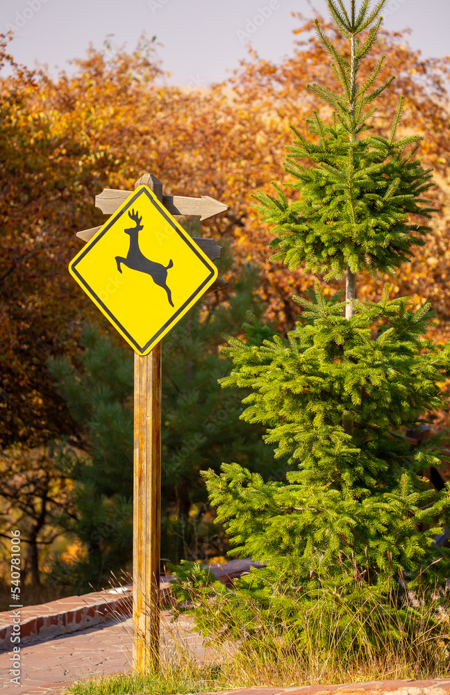 Deer crossing warning yellow sign, California, USA. Caution wild ...