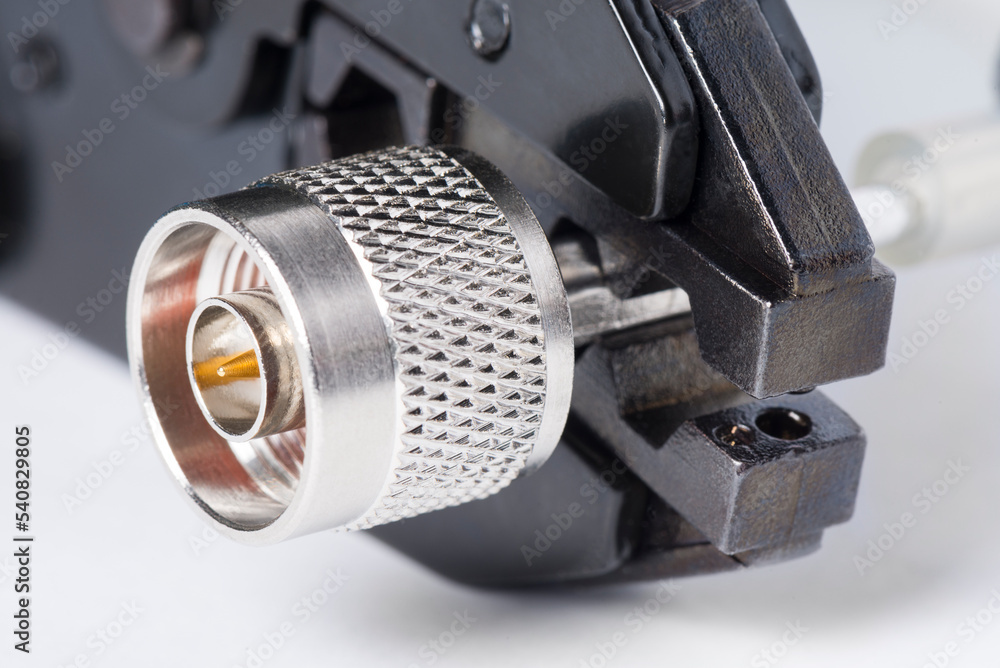 Crimping tool with N male type coaxial connector and cable. High ...