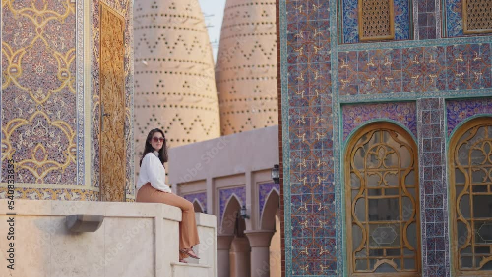 tourist woman sitted at Blue mosque of Katara village made of colorful ...