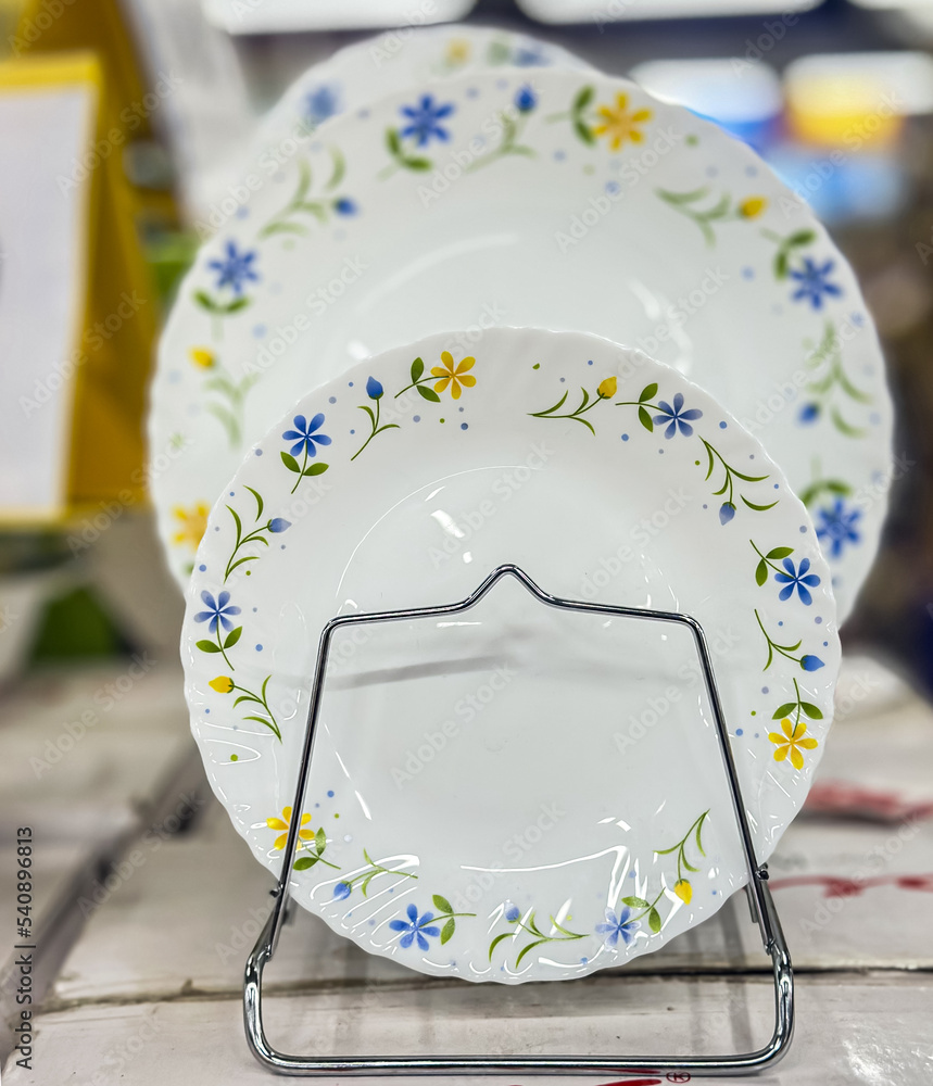 Lined Plates With Shiny And Design Stock Photo | Adobe Stock