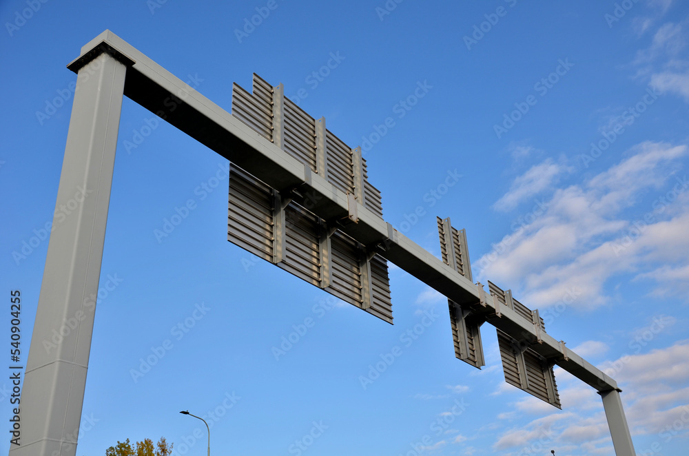 road signs on the highway. frame gate made of metal. the brand is made ...