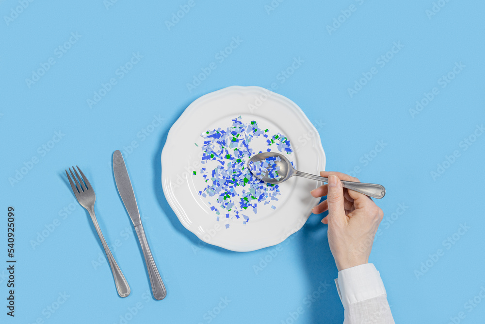 People eat microplastics as food, spoon with fragments in woman hand ...