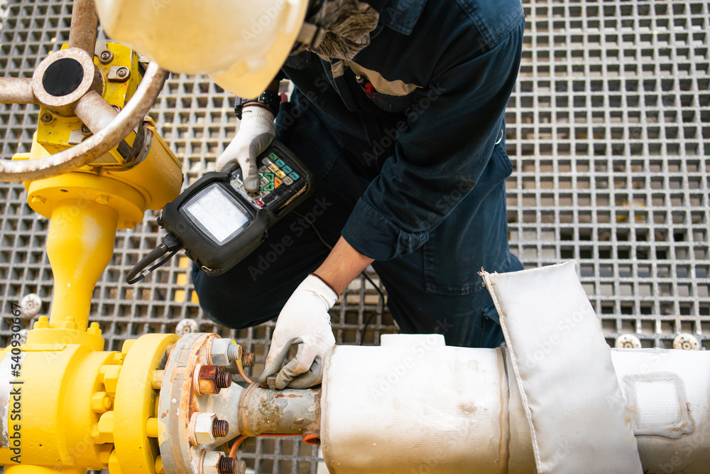 Inspectors inspect pipes in the petrochemical industry with ultrasonic ...