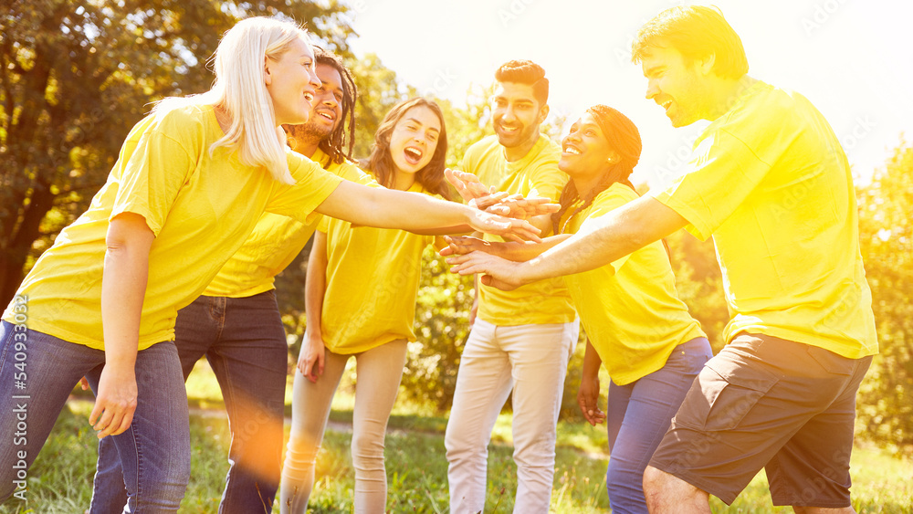 Team laughing while stacking hands for motivation Stock Photo | Adobe Stock